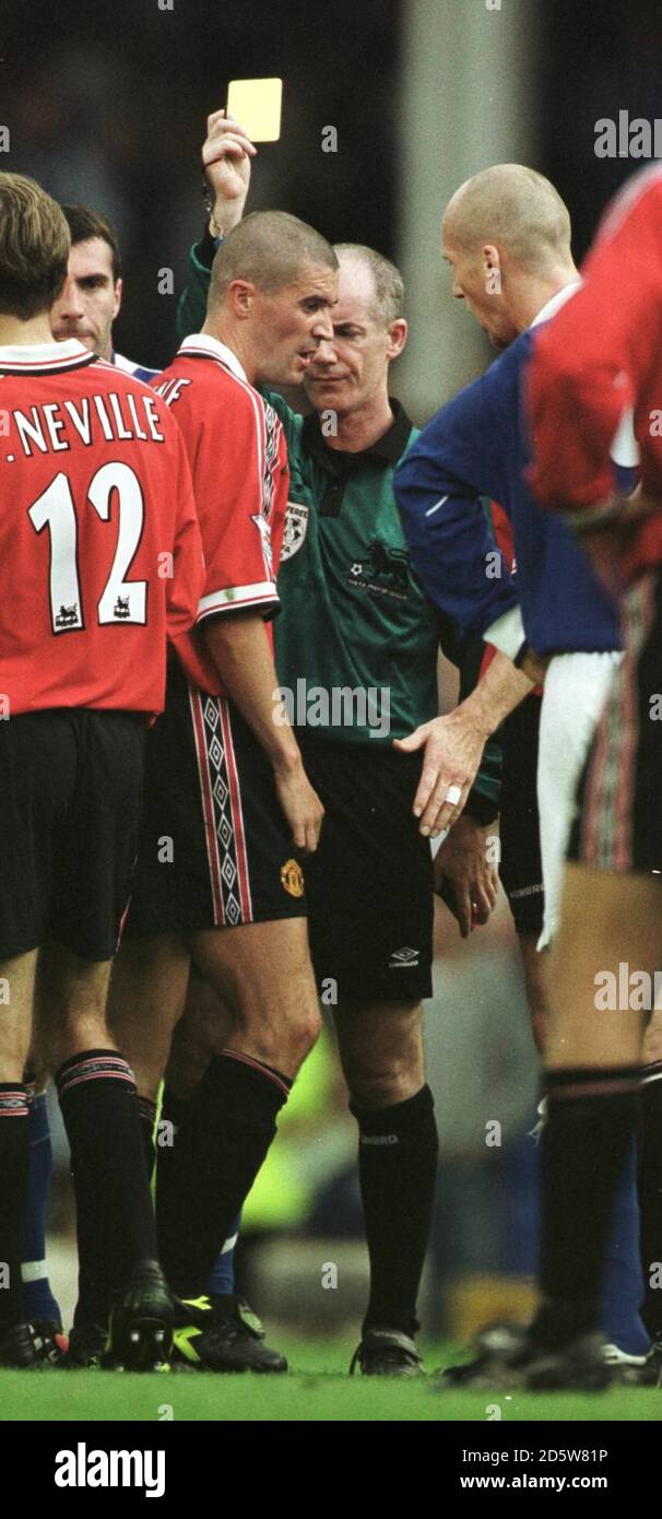 Manchester United's Roy Keane is booked by referee Dermot Gallagher ...