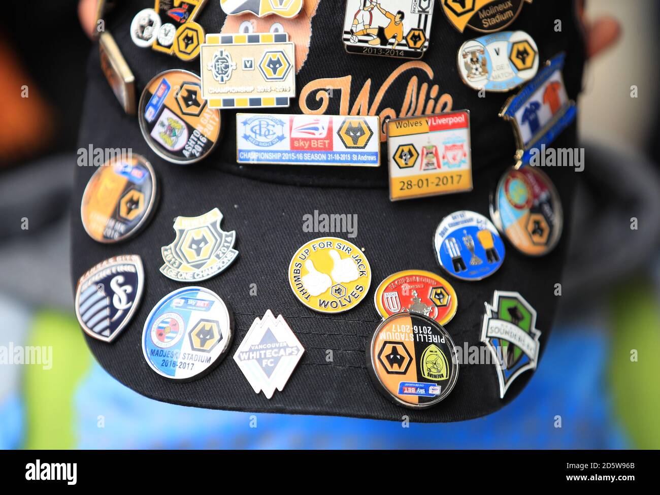 Badges on a young Wolverhampton Wanderers' fans cap Stock Photo - Alamy