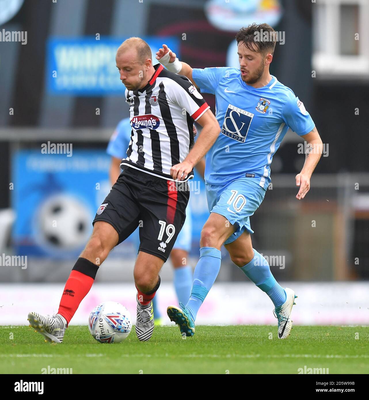 Coventry City's Marc McNulty (right) battles with Grimsby Town's Luke ...