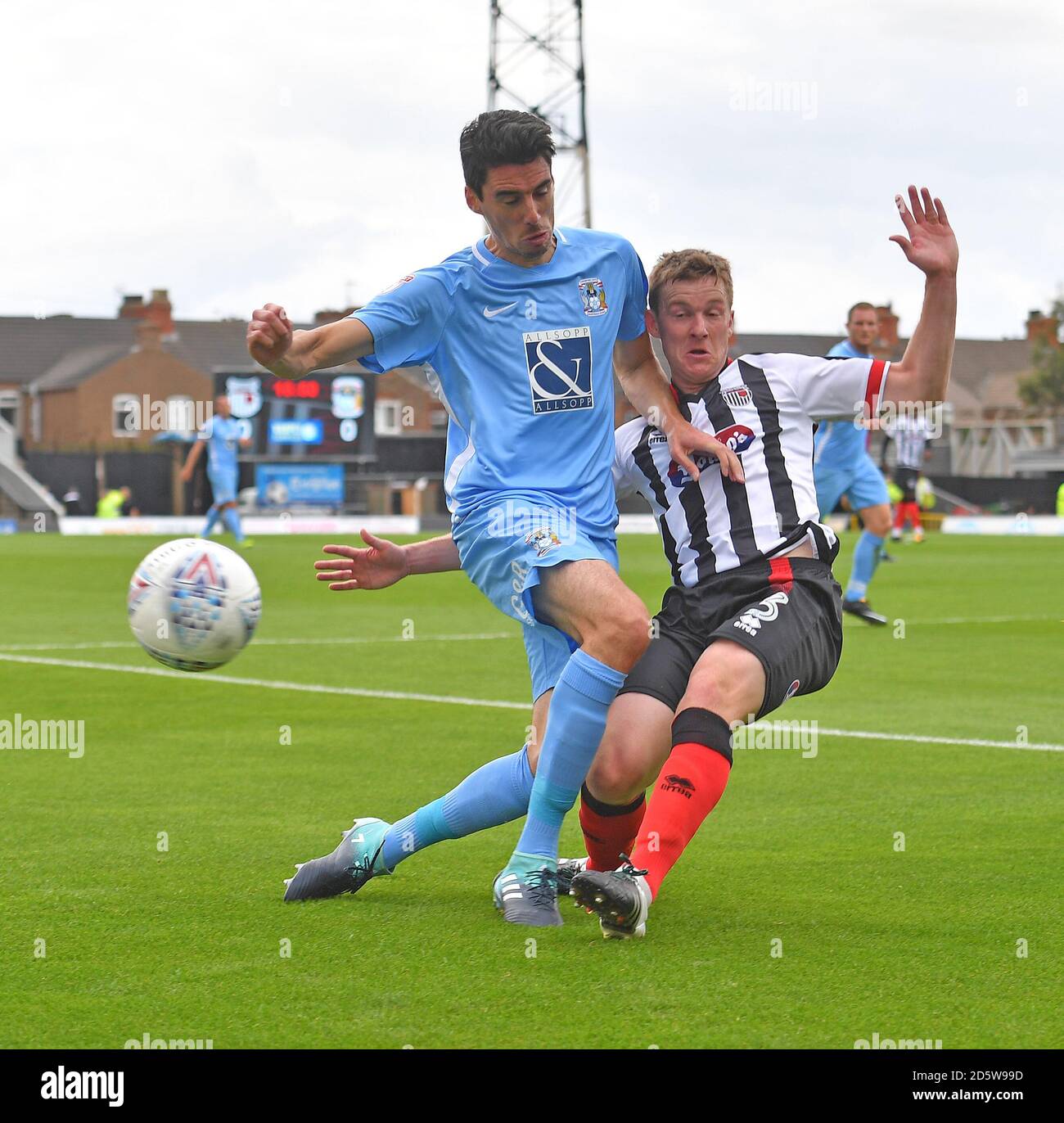 Coventry City's Peter Vincenti (left) battles with Grimsby Town's Paul ...