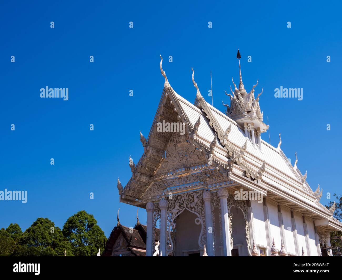 Gorgeous fine white hall in Buddhist temple and the bright blur sky ...