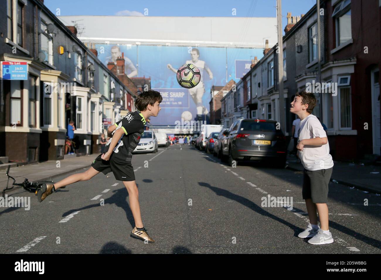 Kids playing football at everton Stock Photo - Alamy