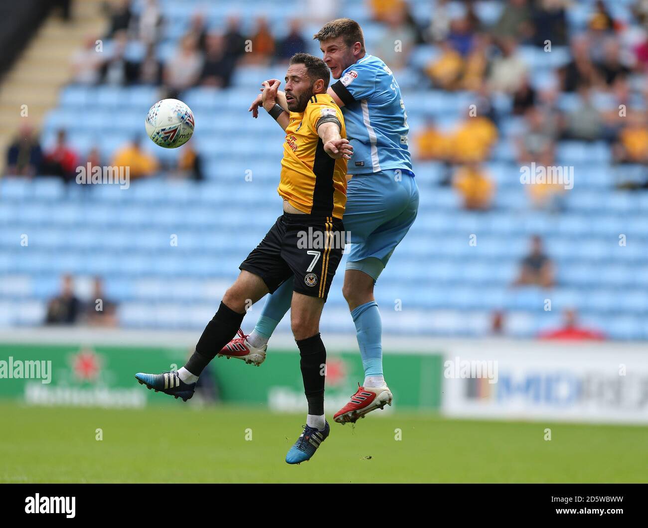 Coventry City's Chris Stokes and Newport County's Robbie Willmott ...