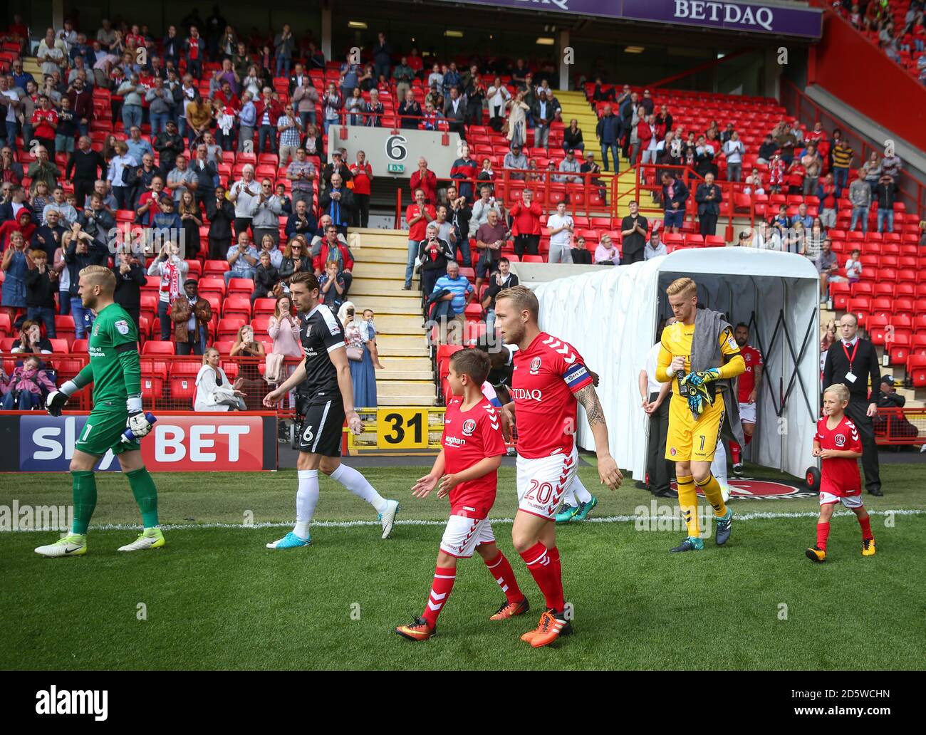 Charlton Athletic captain Chris Solly leads out the team with the match ...