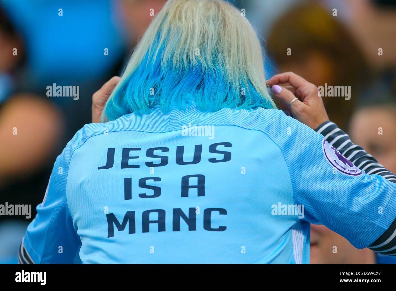 Wearing manchester city shirt hi-res stock photography and images - Alamy