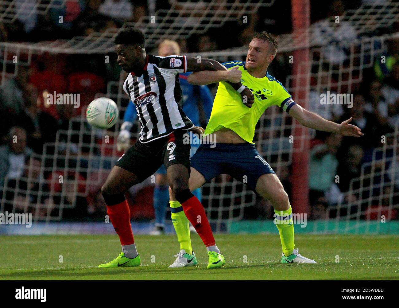 Derby County's Alex Pearce (right) and Grimsby Town's JJ Hooper battle ...