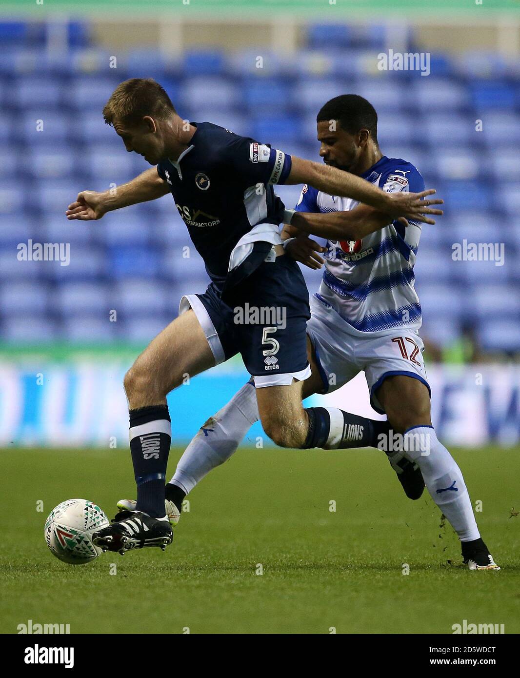 Millwall's Tony Craig and Reading's Garath McCleary battle for the ball ...