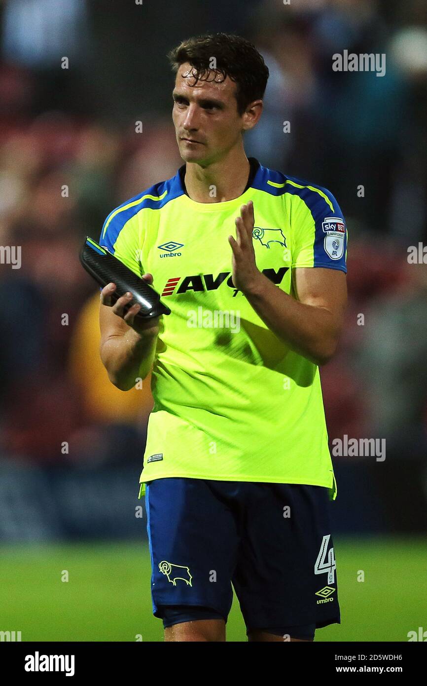 Derby County's Craig Bryson applauds the travelling support Stock Photo ...