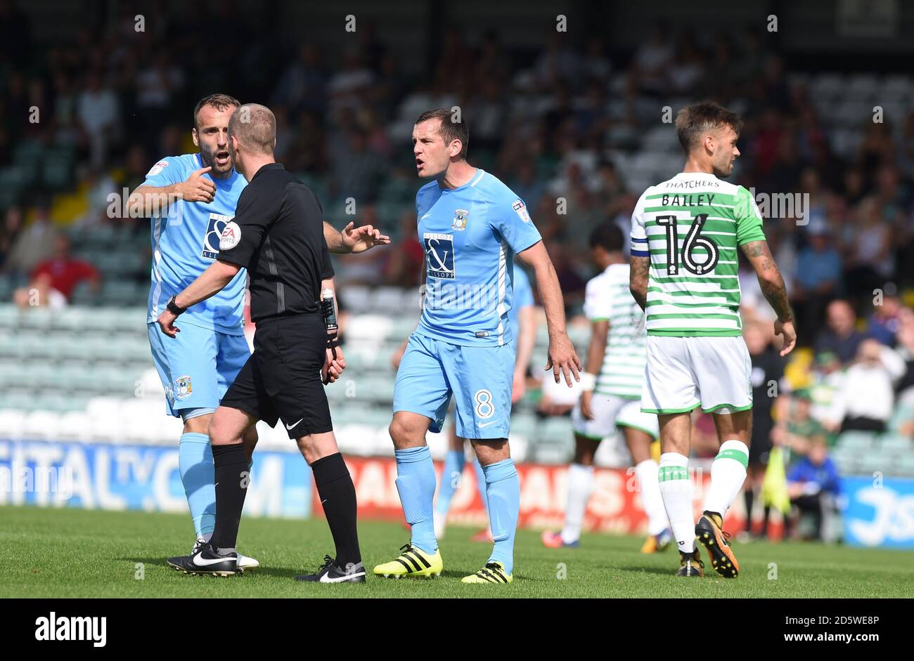 Coventry City's Michael Doyle (centre) argues with the referee Stock ...