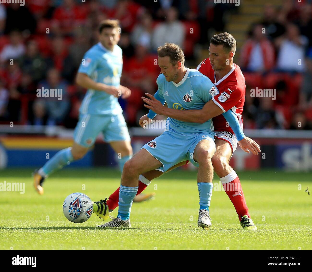 Barnsley's Matty Pearson (Right) and Sunderland's Aiden McGeady battle ...