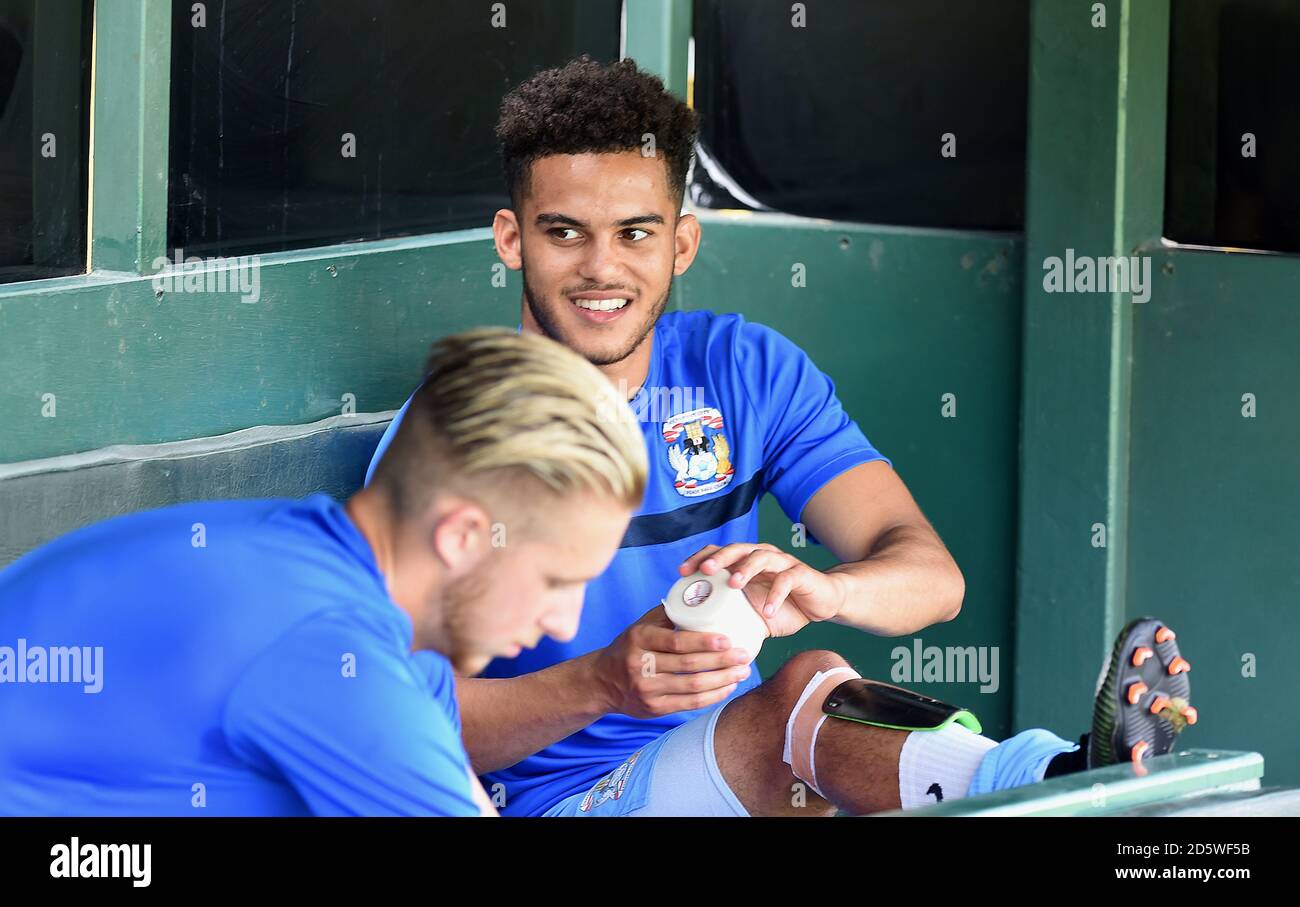 Coventry City's Dion Kelly-Evans tapes up his shin pads before the game ...
