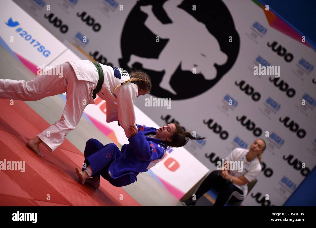 Wales' Ffion Robinson and England's Chloe Dodge compete during the Judo ...