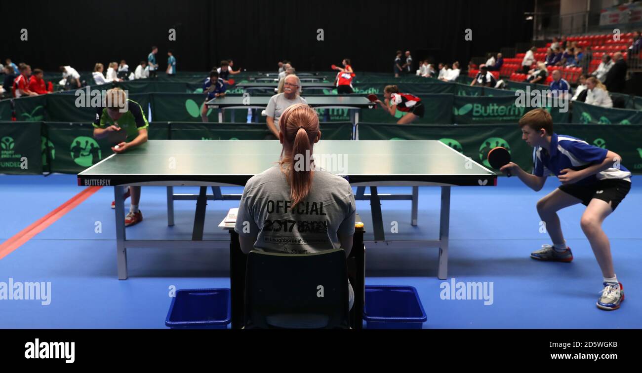 An official keeps an eye on the action during the team table tennis ...