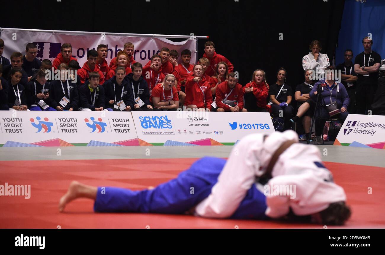 Wales' Morgan Daly and England's Max Greggory are cheered on by team ...