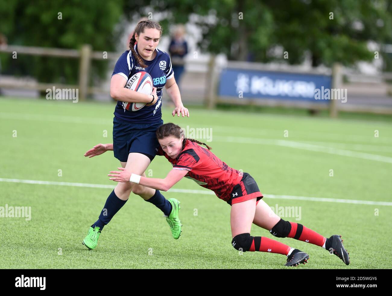 Scotland's Rebecca Bestwick (left) and Wales' Lucy Packer in action ...