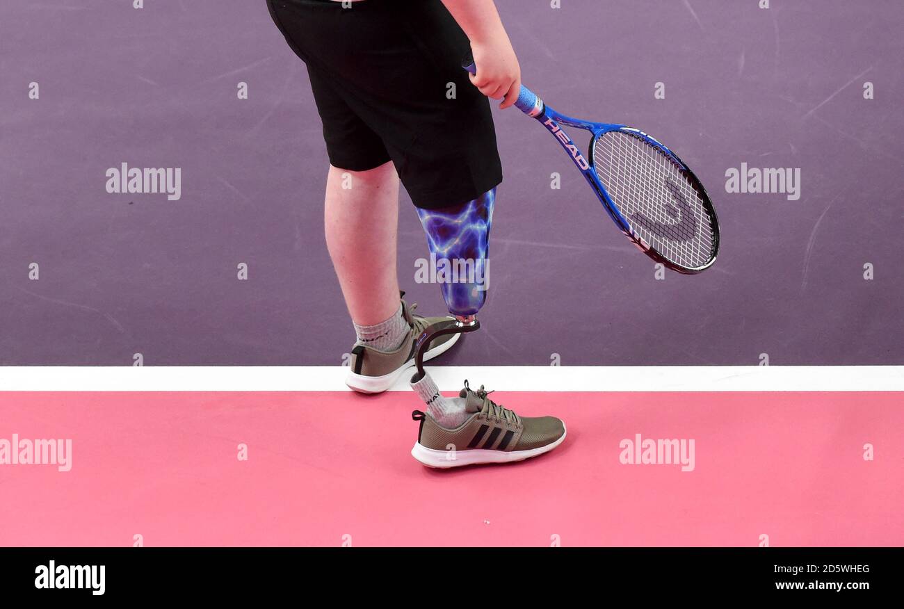 Detail of a prosthetic leg and a tennis racket during the Wheelchair ...