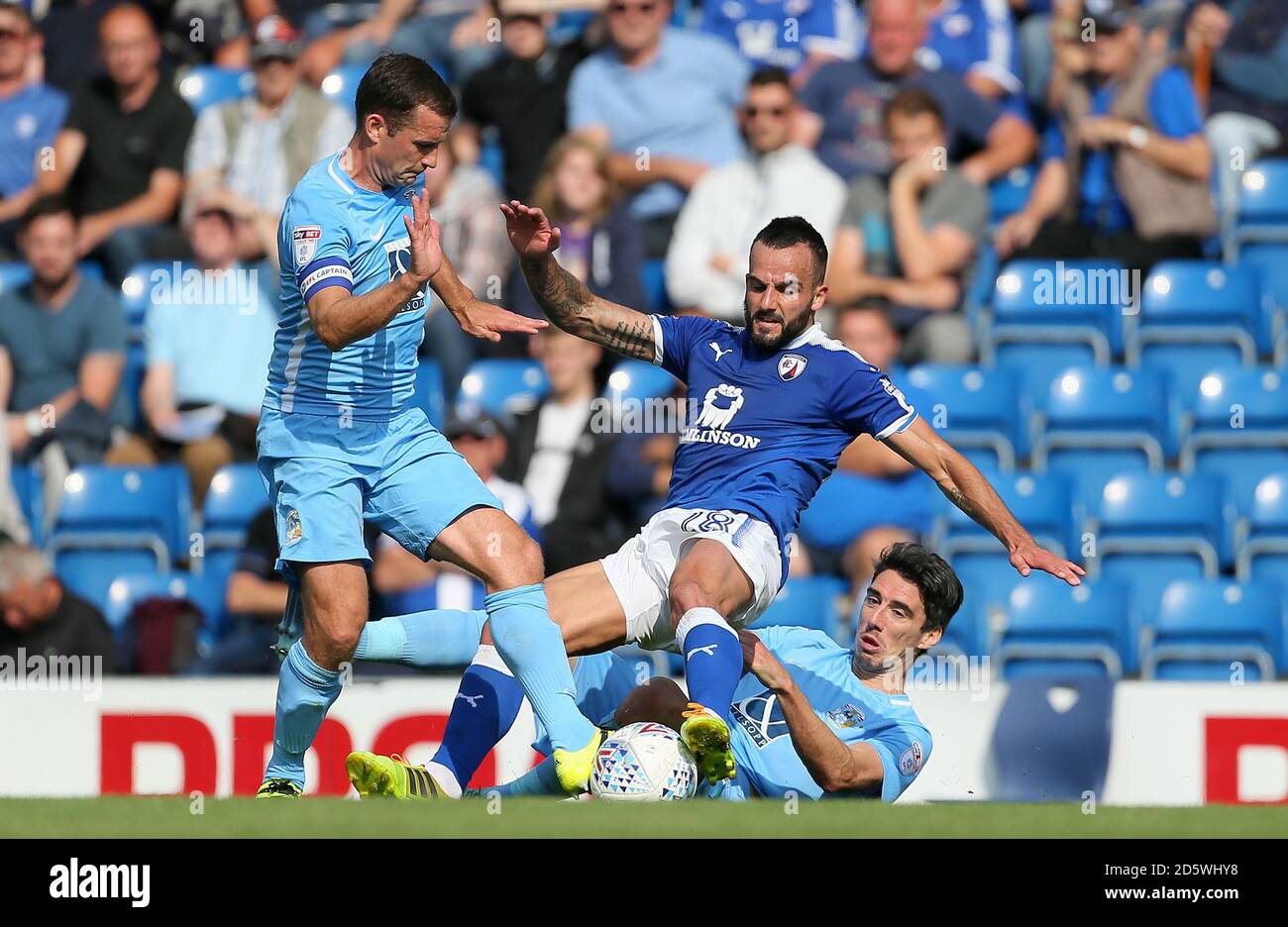 Coventry City's Michael Doyle (left) and Peter Vincenti battle with ...