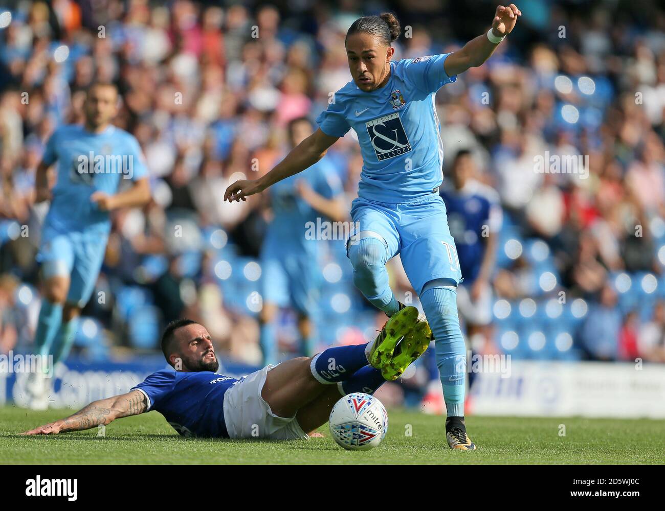 Chesterfield's Robbie Weir (left) challenges Coventry City's Jodi Jones ...