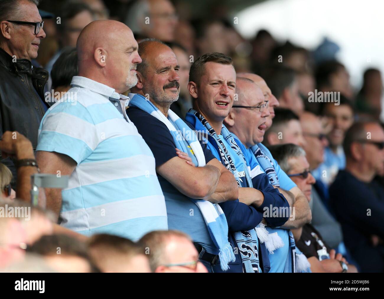 Coventry City fans in the stands Stock Photo - Alamy