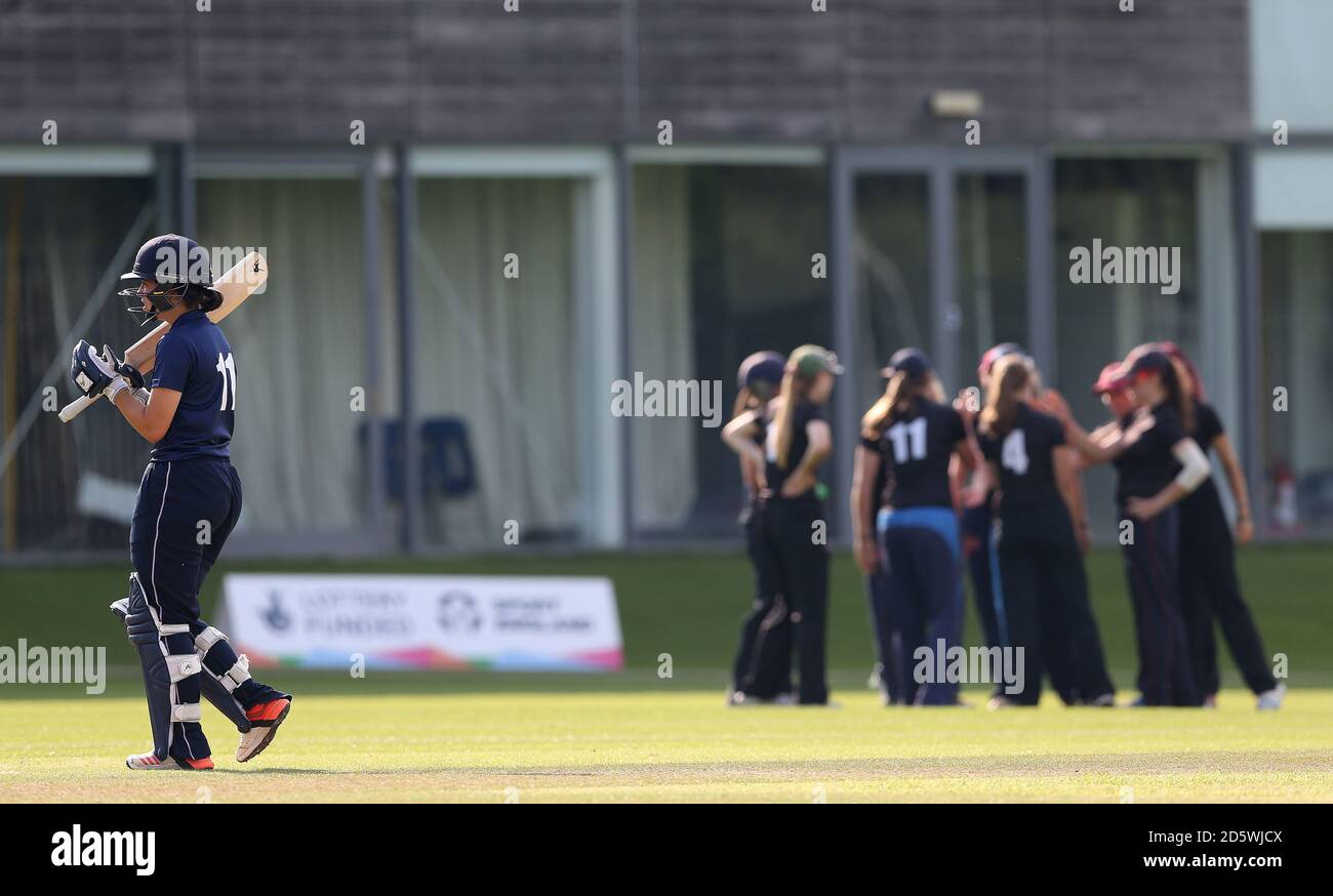 Team Sciver's (Blue) Nancy Harman walks back to the pavillion as Team ...