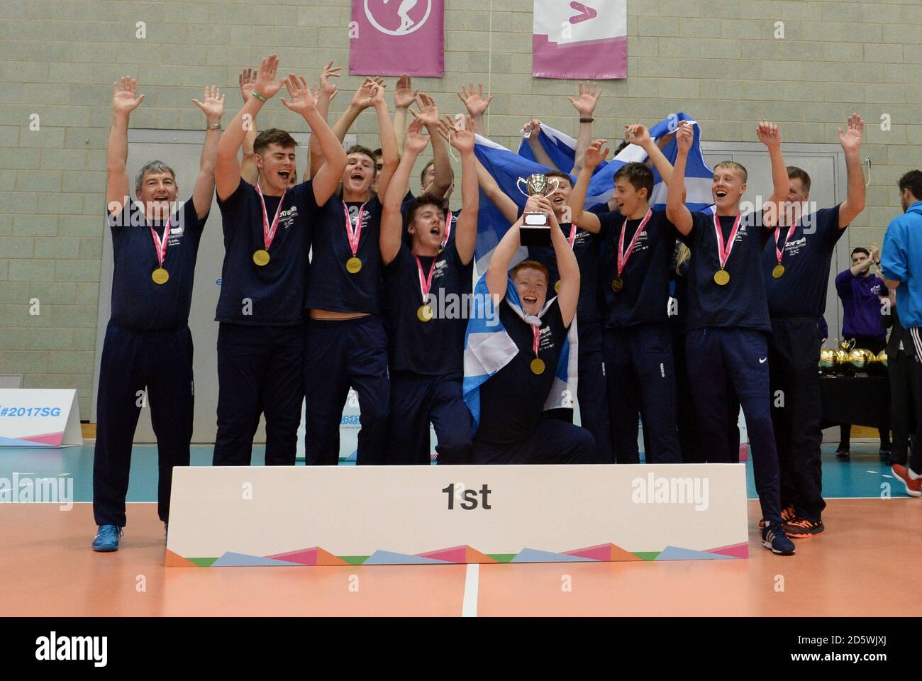 Scotland East (gold) hold up their trophy in the Volleyball ...