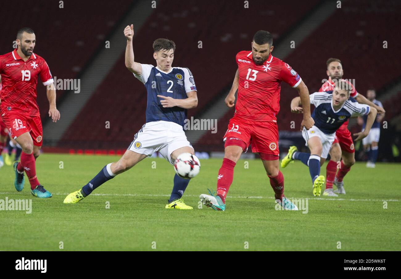 Scotland Kieran Tierney is stopped by Malta's Zach Muscat (right Stock ...