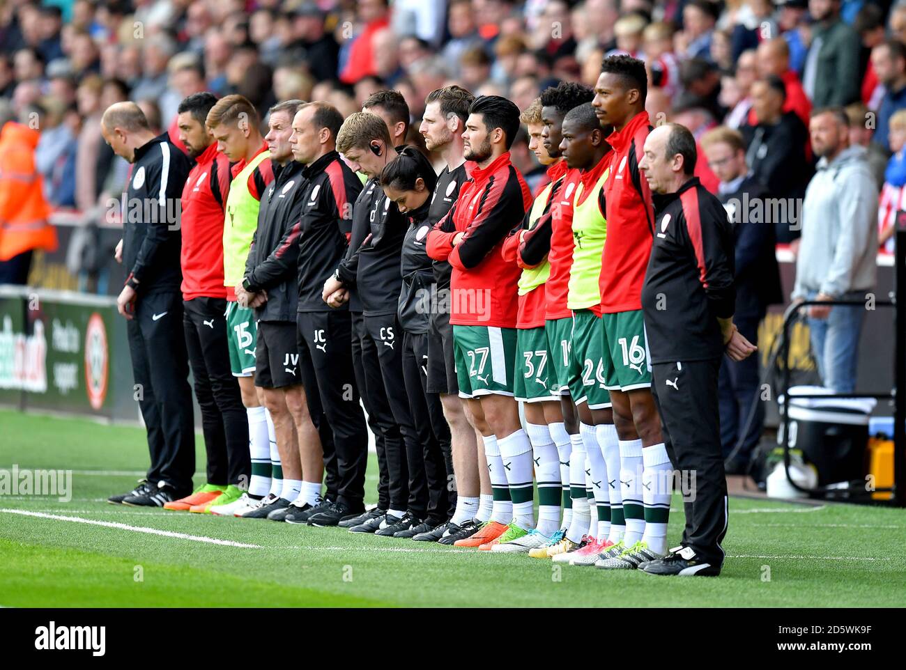 Barnsley players and staff during a minute's silence Stock Photo - Alamy