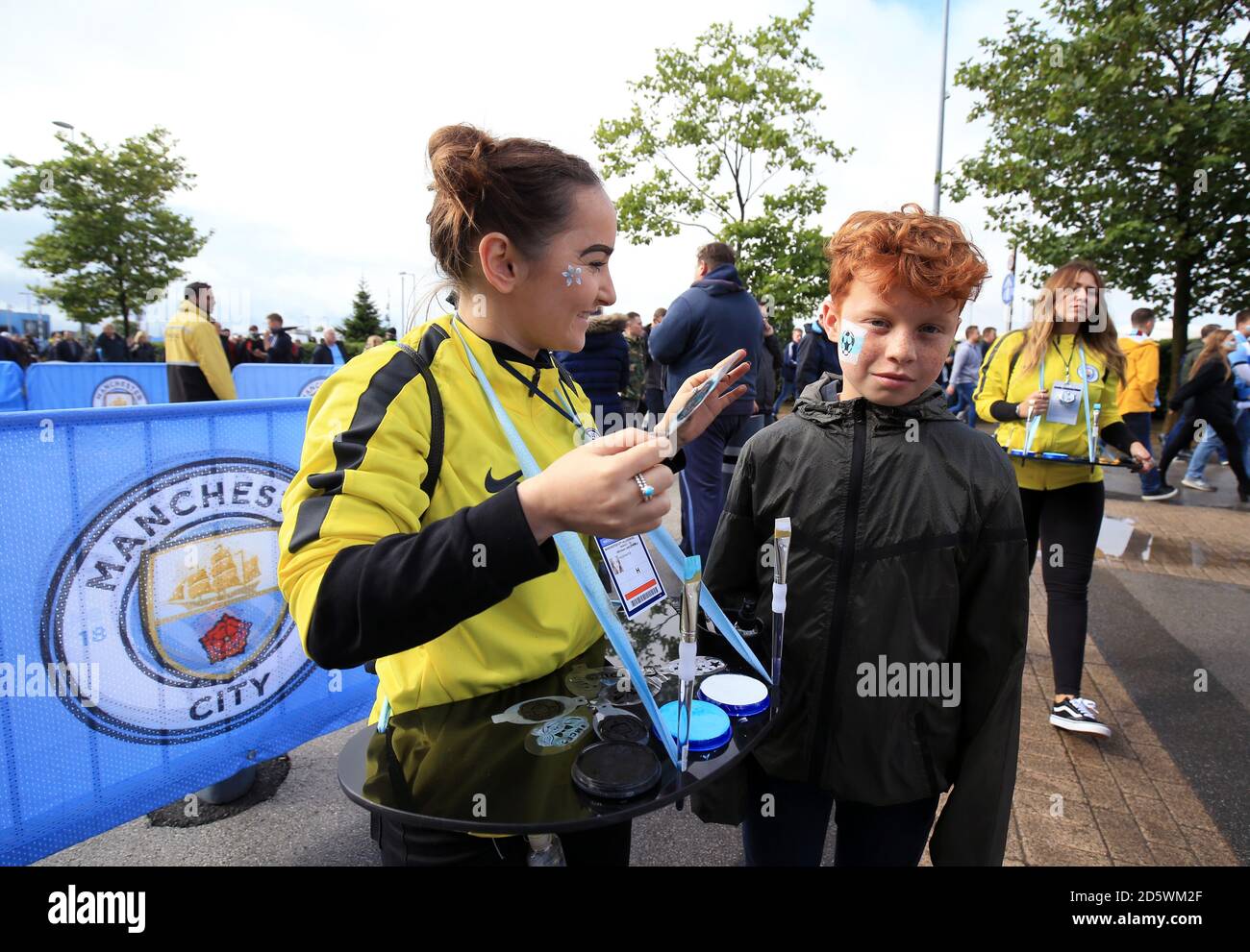 Young Manchester City fan Gruff Jones has his face painted ahead of the ...