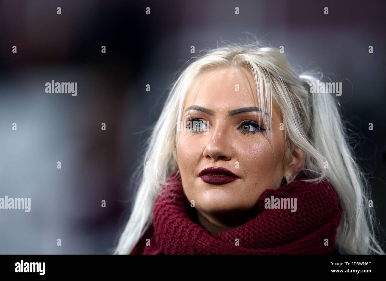 A female West Ham United fan in the stands Stock Photo - Alamy