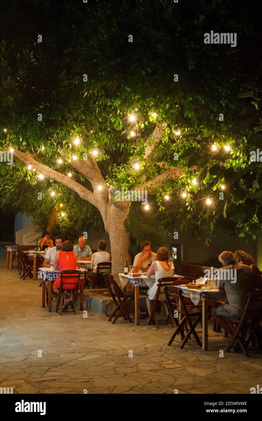 Village restaurant at night, in Livadia town, Tilos island, Dodecanese ...