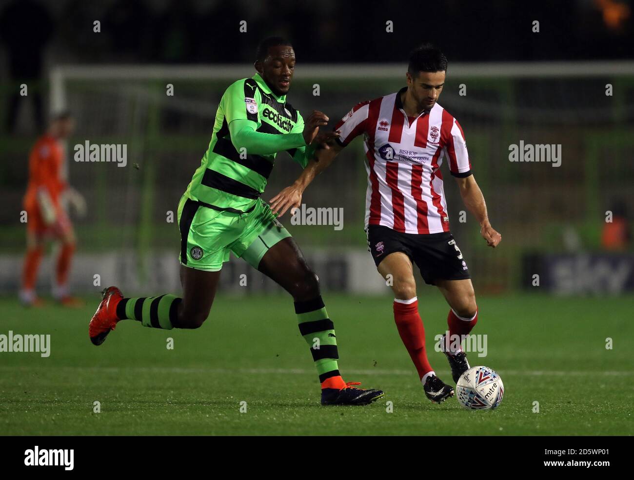 Forest Green Rovers' Shamir Mullings (left) and Lincoln City's Samuel ...