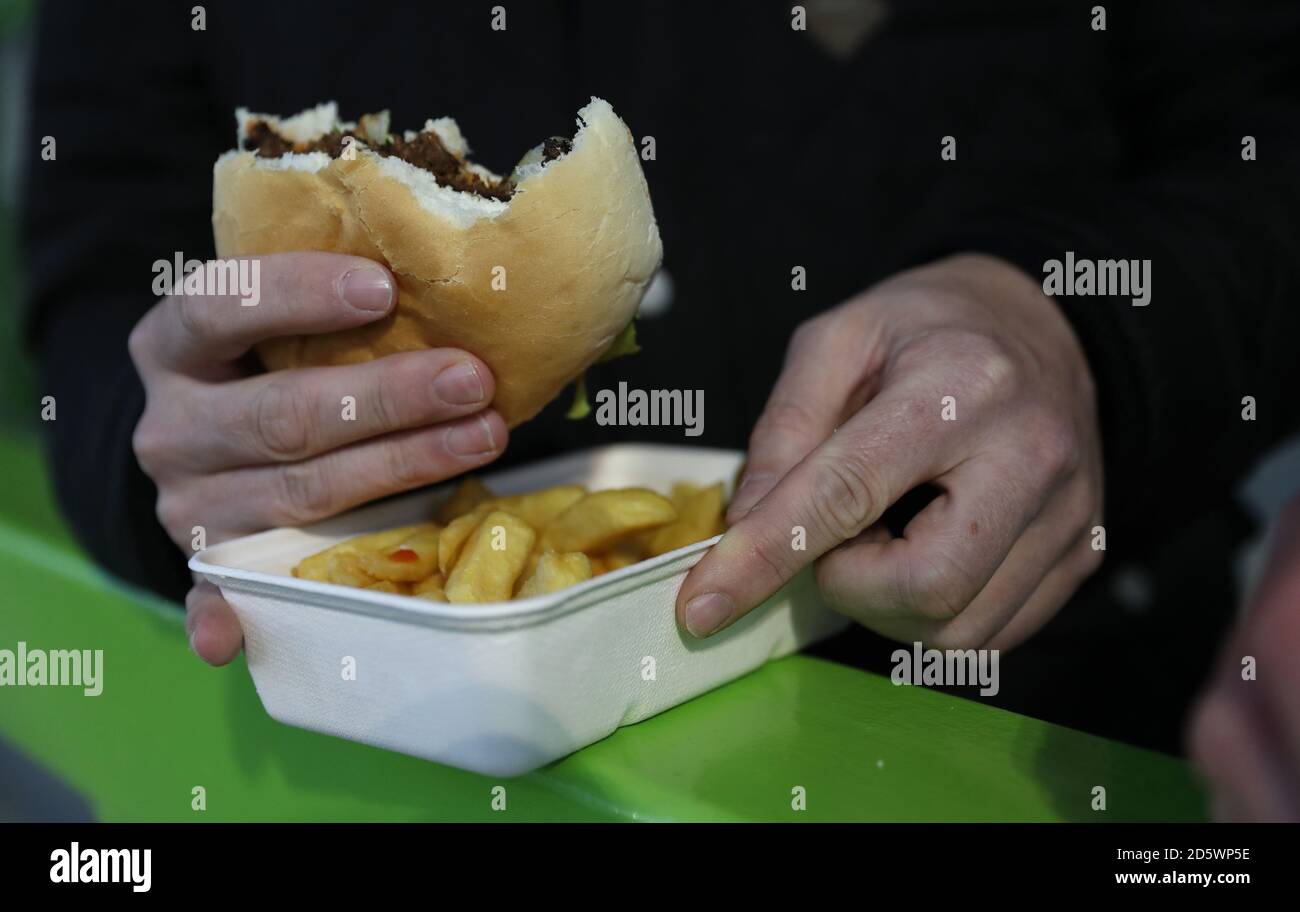 Fans eat a Veggie burger in the stands Stock Photo - Alamy