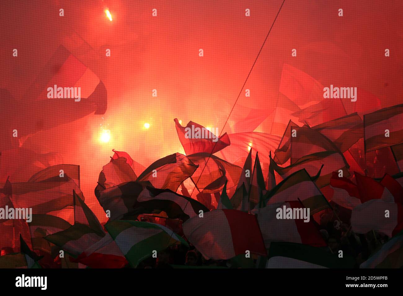 Football in the stands flares red smoke hi-res stock photography and ...