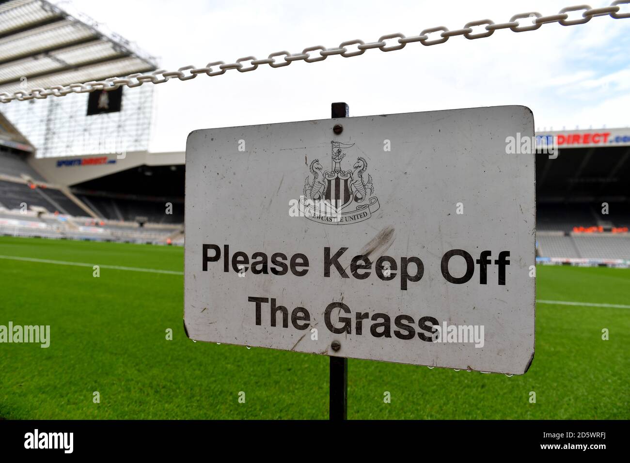 General view of a please keep off the grass sign pitchside at St James ...