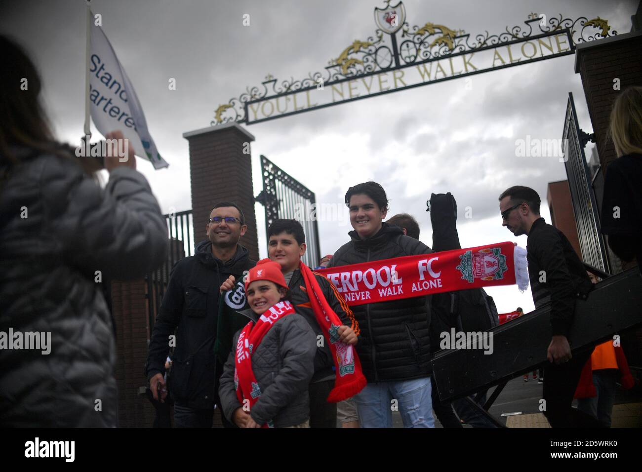 Liverpool fans pose for a photo outside the ground Stock Photo - Alamy