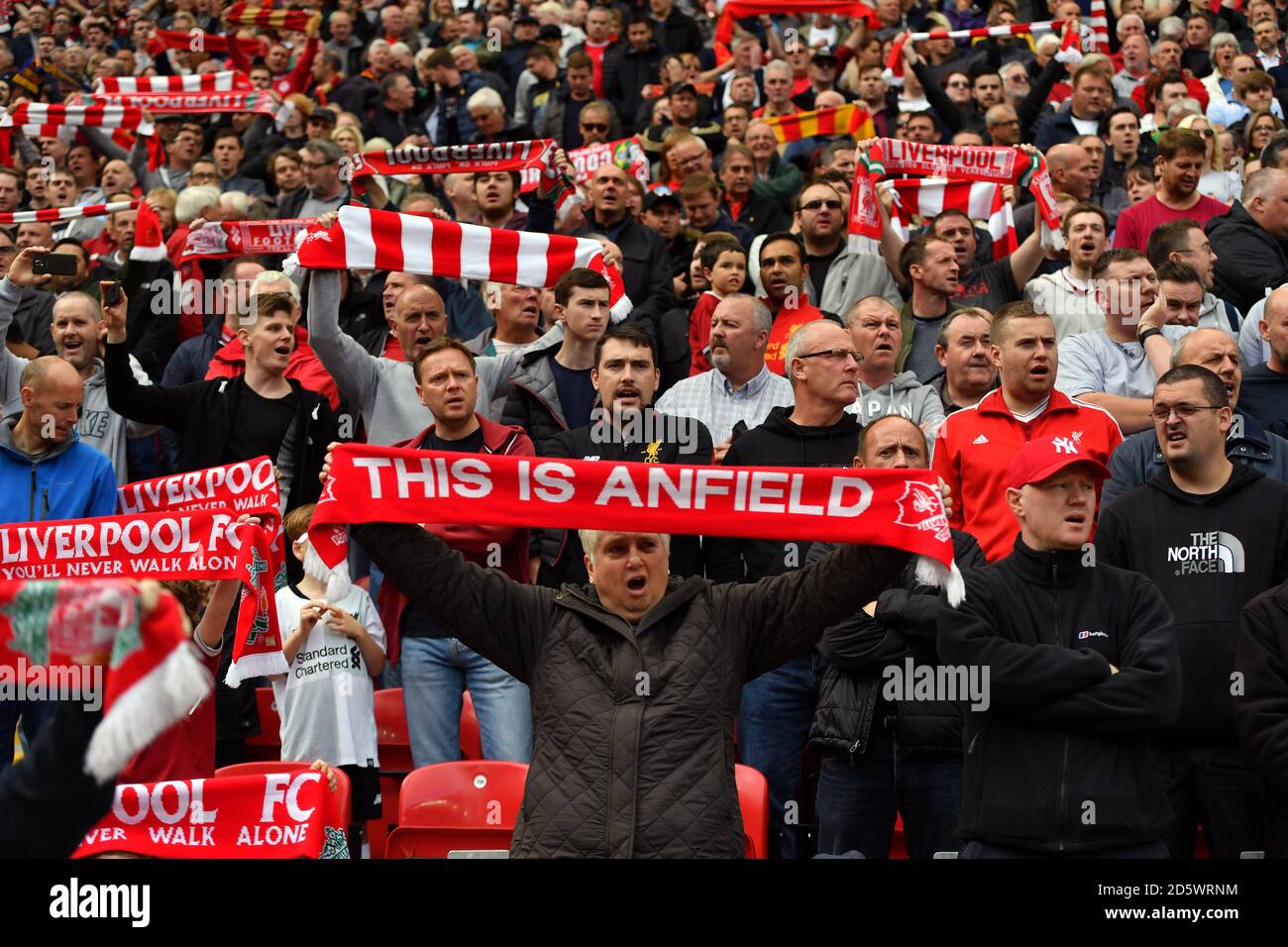 Liverpool fans in the stands Stock Photo - Alamy