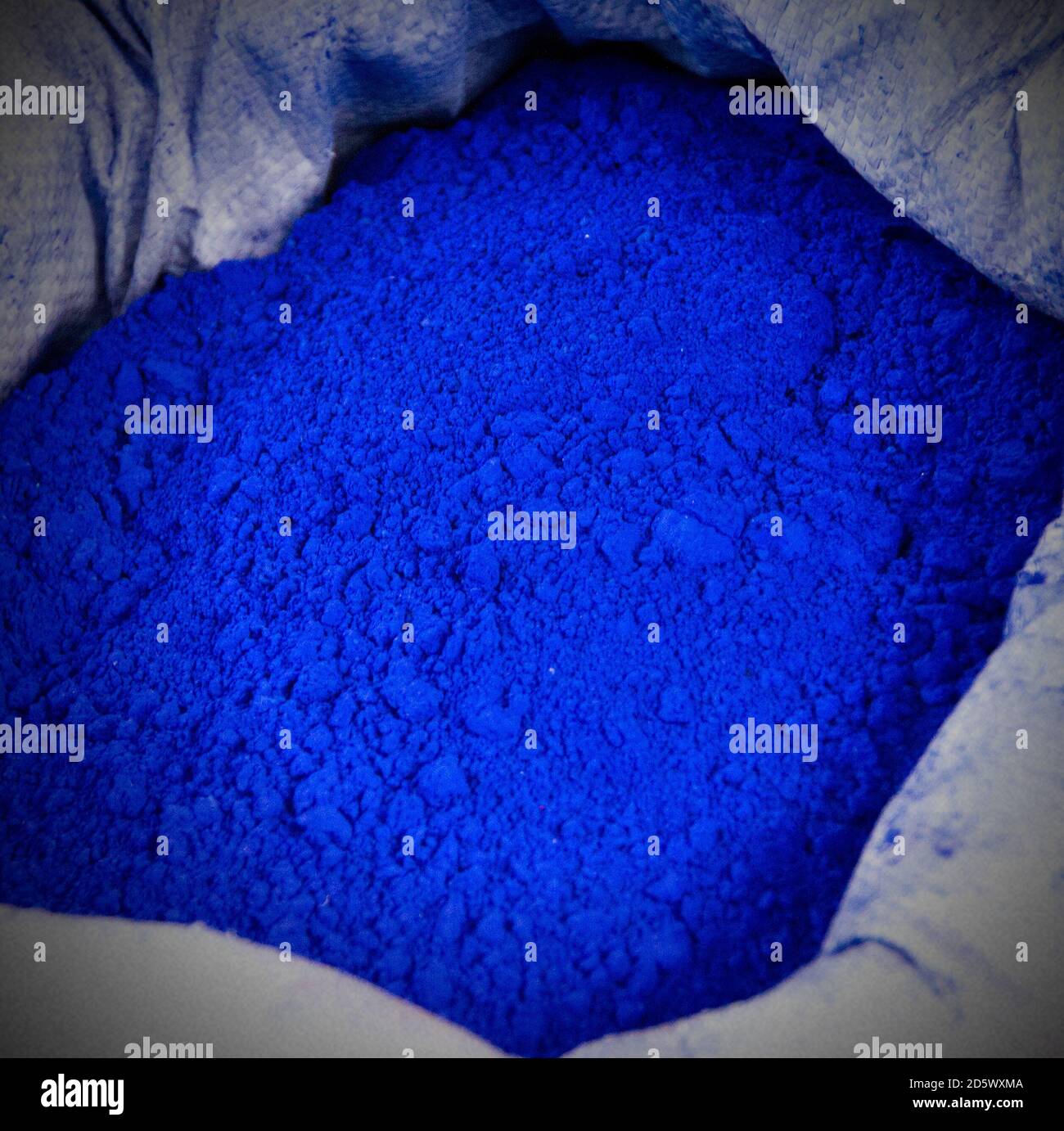 Powder of blue natural colorant in bag on the street in the blue medina ...