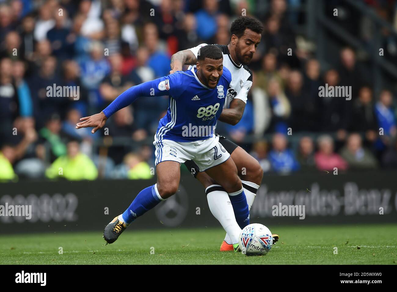 Birmingham City's David Davis (left) shields the ball from Derby County ...