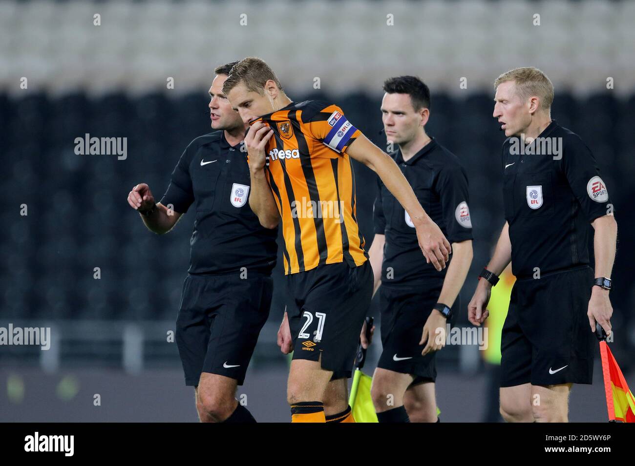 Hull City's Michael Dawson complains to the referee James Linnington ...