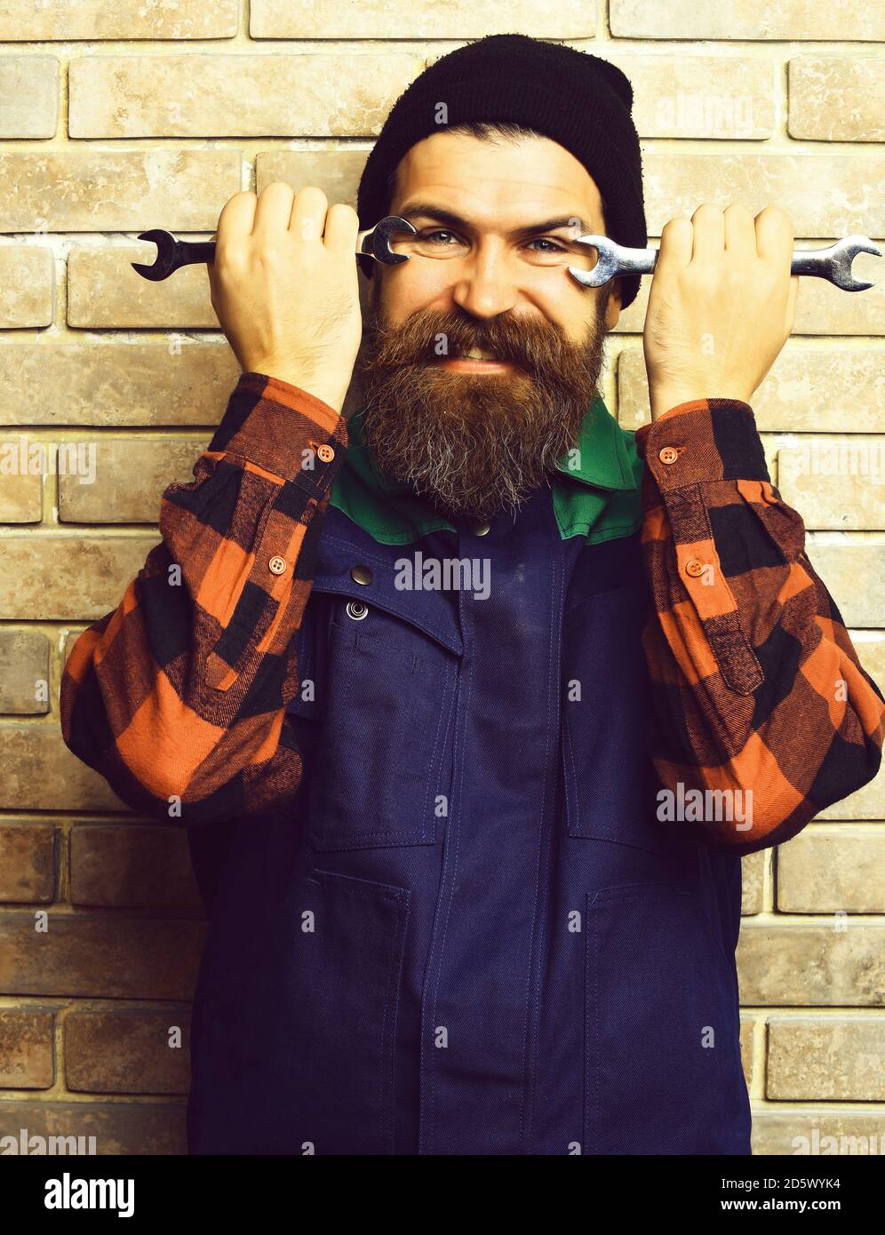 Bearded man, long beard. Brutal caucasian mechanic, smiling happy ...