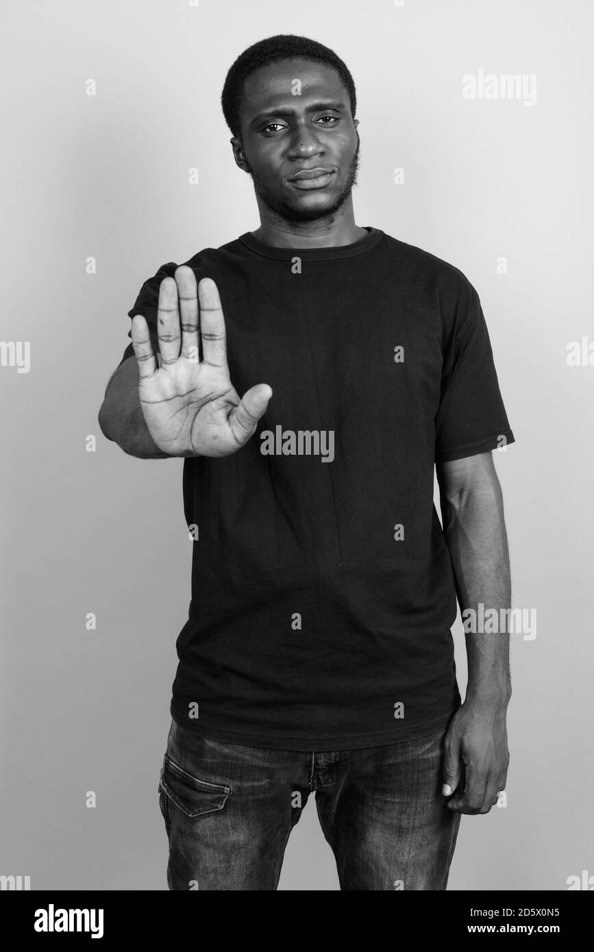 Black guy stop sign palm hand Black and White Stock Photos & Images - Alamy