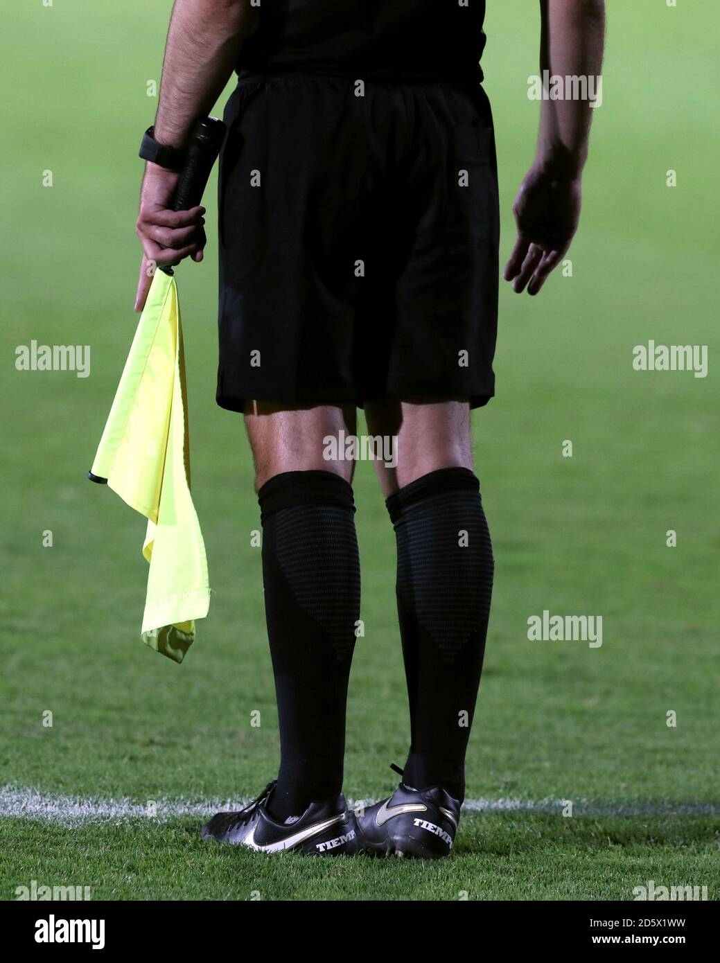 A linesman holds his flag Stock Photo - Alamy