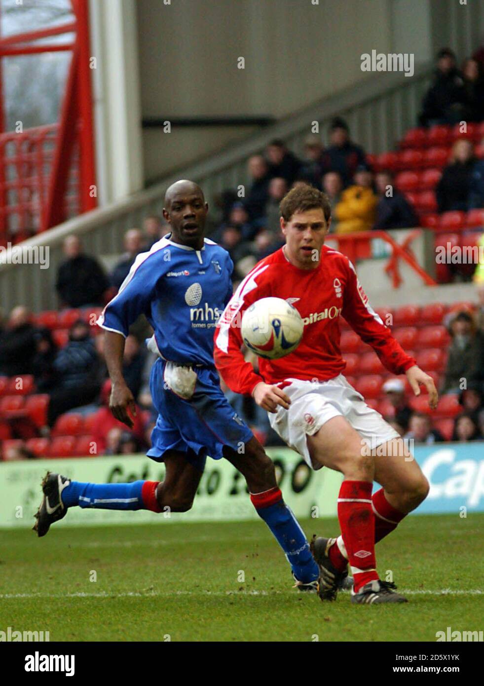 Nottingham Forest's Grant Holt and Gillingham's Ian Cox in action Stock ...