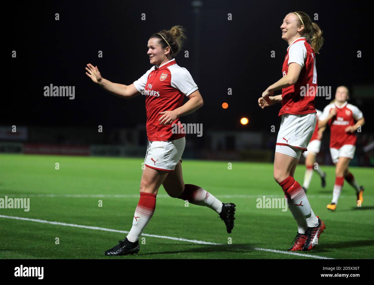 Arsenal's Emma Mitchell (left) celebrates scoring the third goal Stock ...
