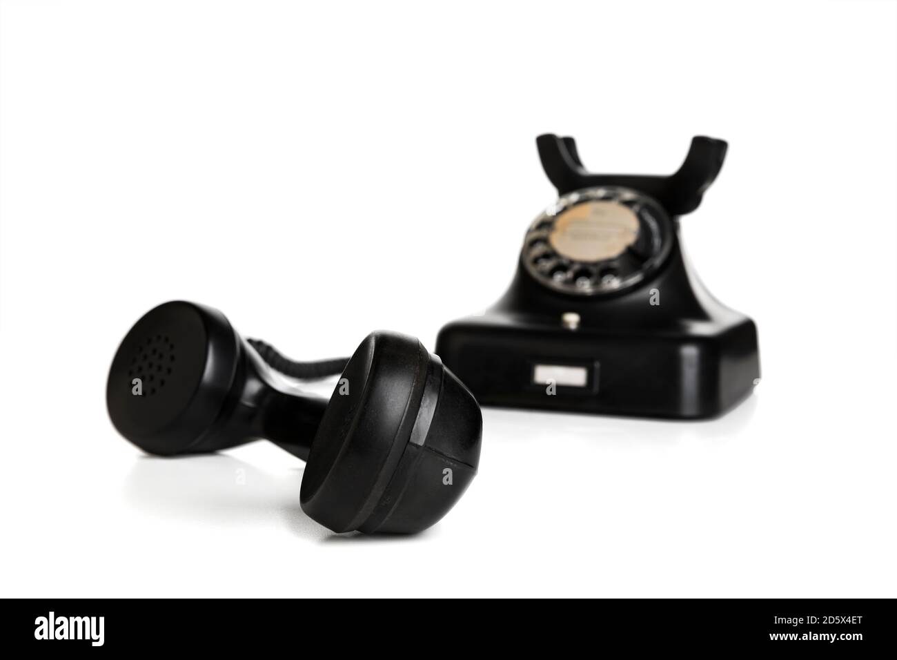 Vintage black telephone with receiver off-hook isolated on white ...