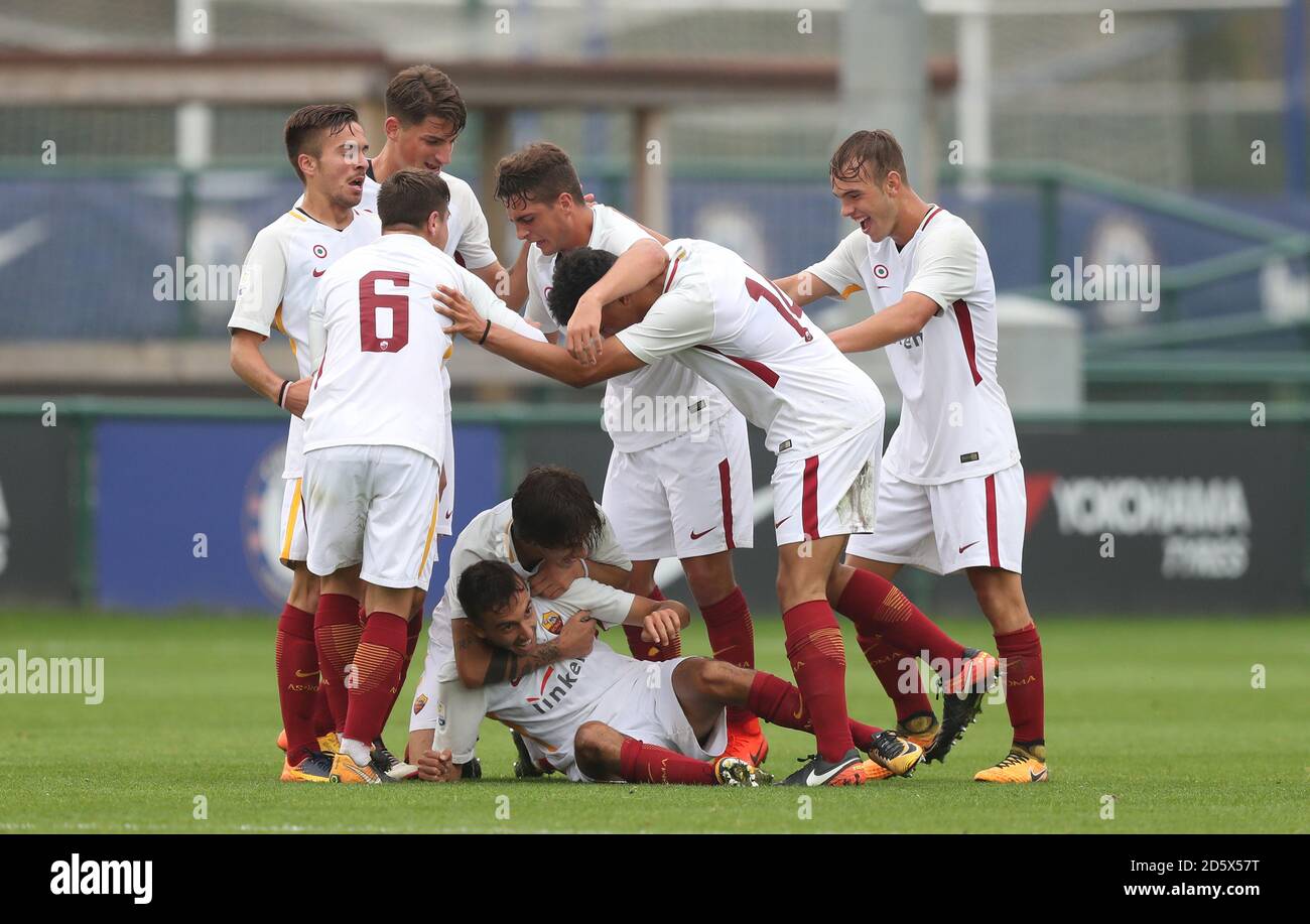 AS Roma's Lorenzo Valeau (bottom) celebrates with his team mates after ...