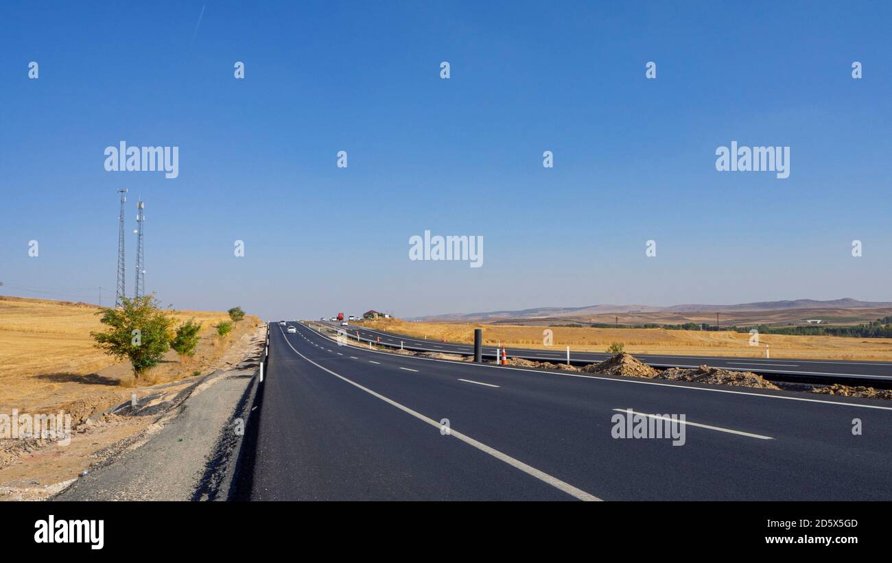 newly built asphalt road highway and vehicles long asphalt road Stock ...