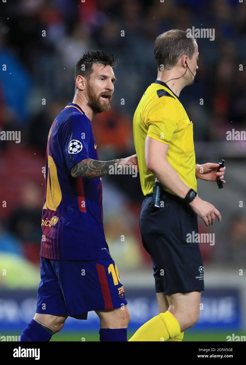 Barcelona's Lionel Messi (left) appeals to referee William Collum Stock ...