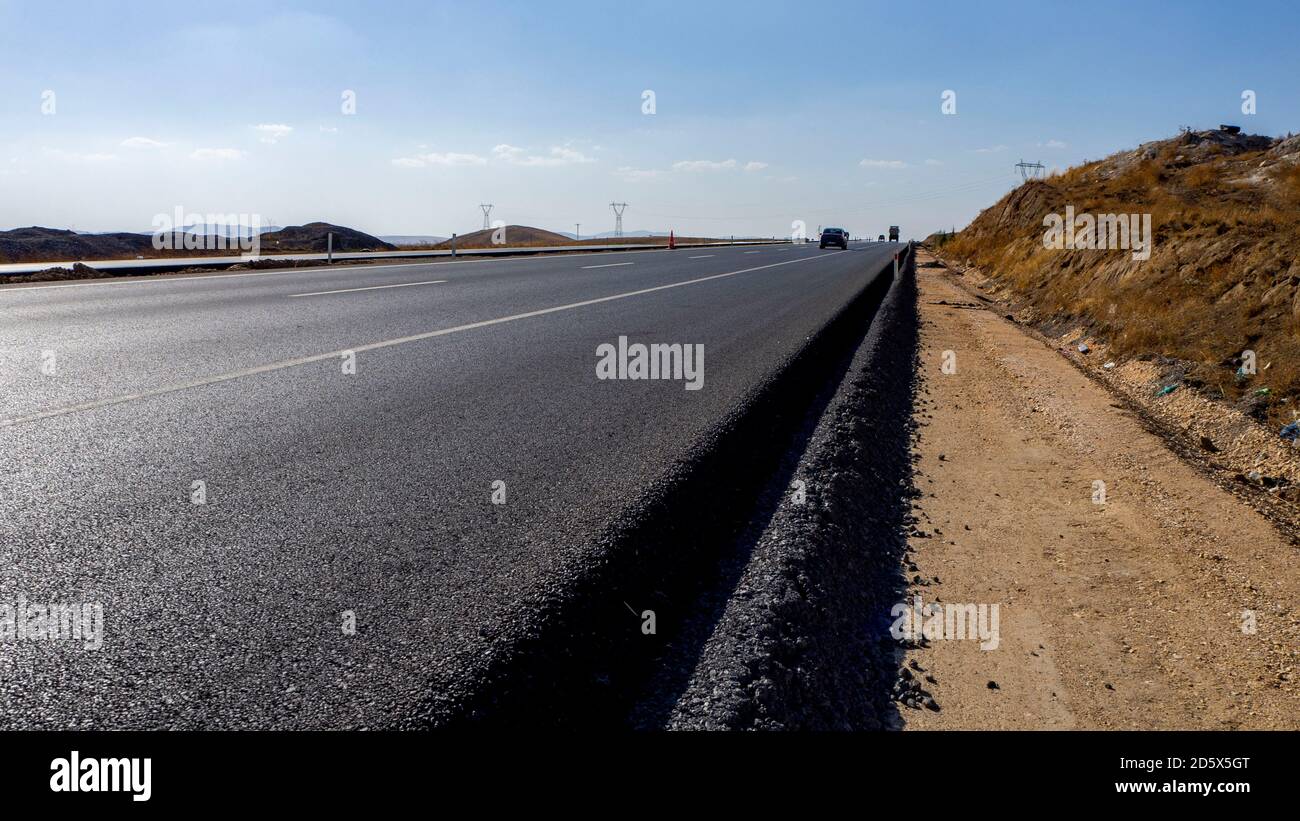 newly built asphalt road highway and vehicles long asphalt road Stock ...