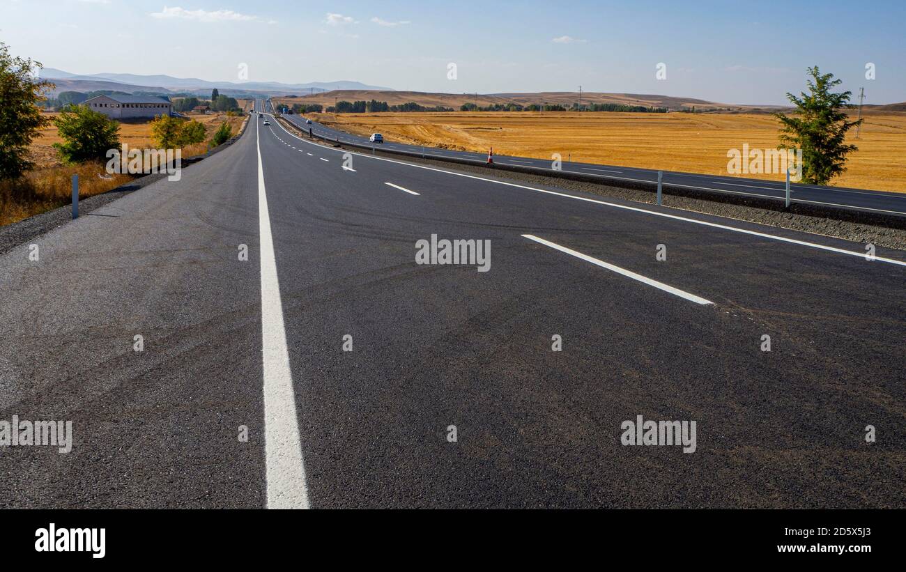 newly built asphalt road highway and vehicles long asphalt road Stock ...
